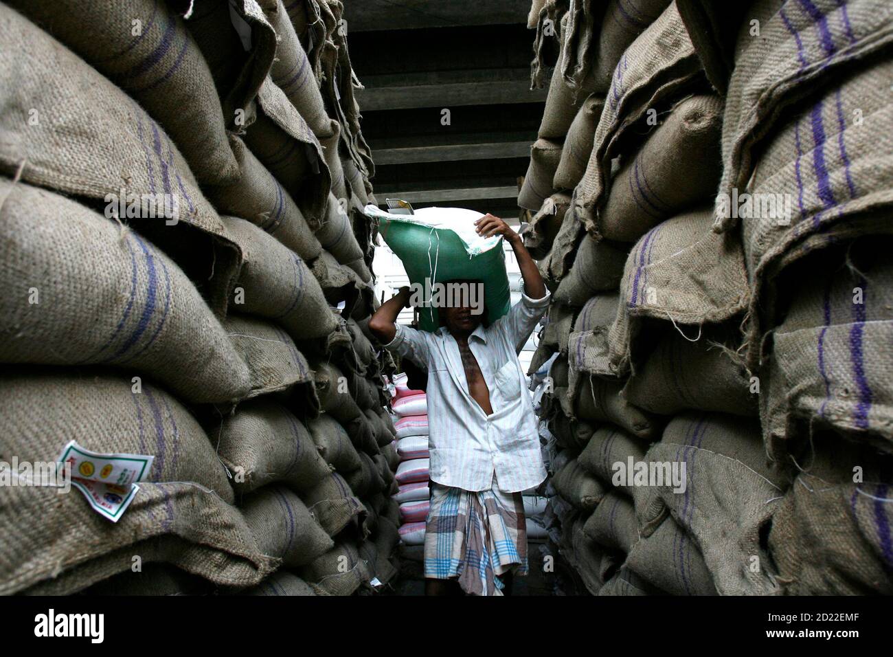 Man carrying a rice bag High Resolution Stock Photography and Images ...