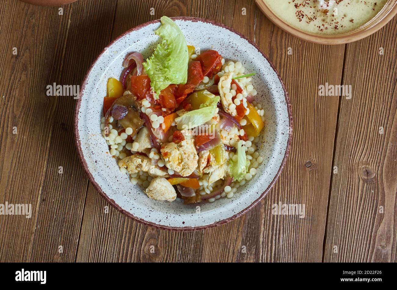 Israel Ptitim casserole with chicken and vegetables . Middle Eastern ...