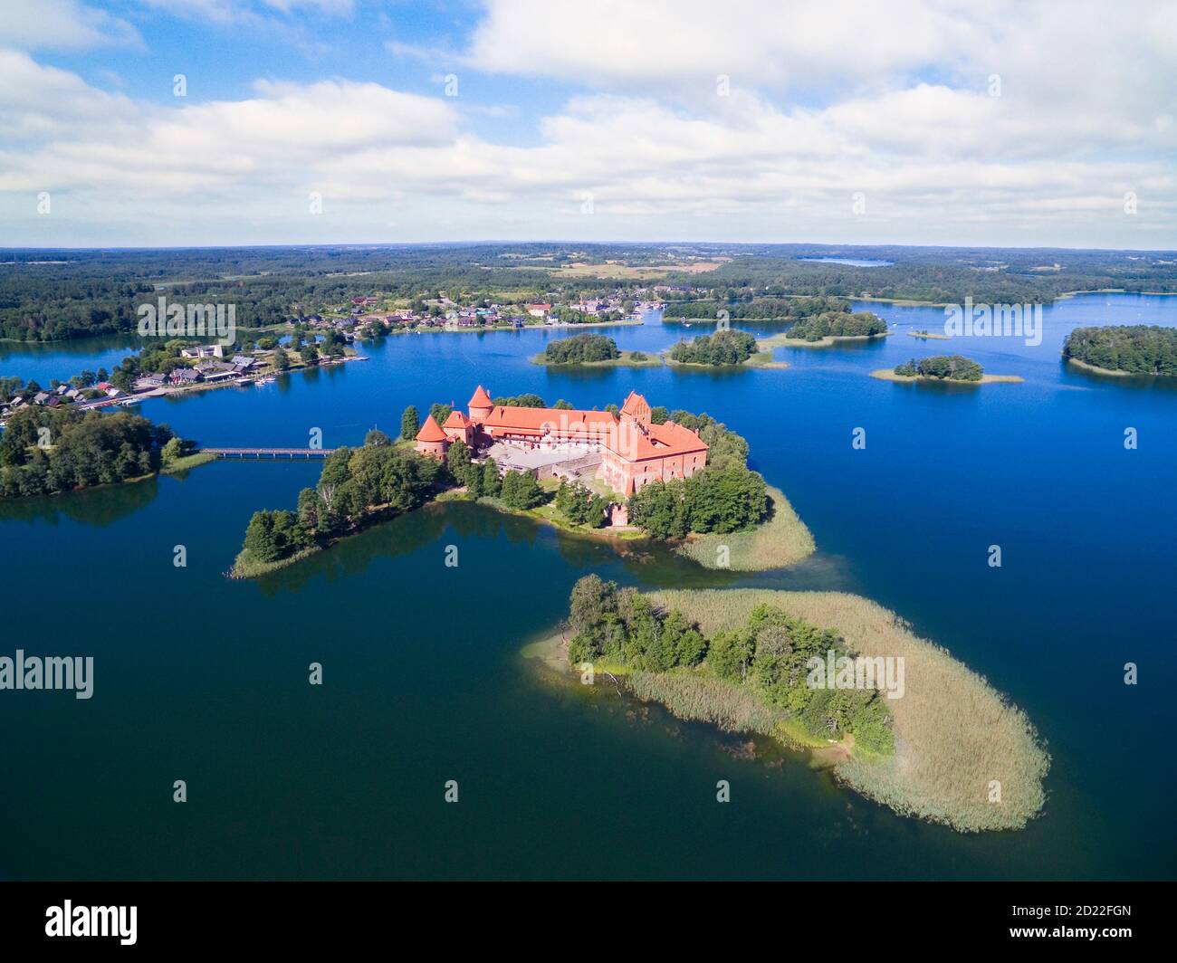 Aerial view of beautiful Gothic style red brick castle on an island on ...