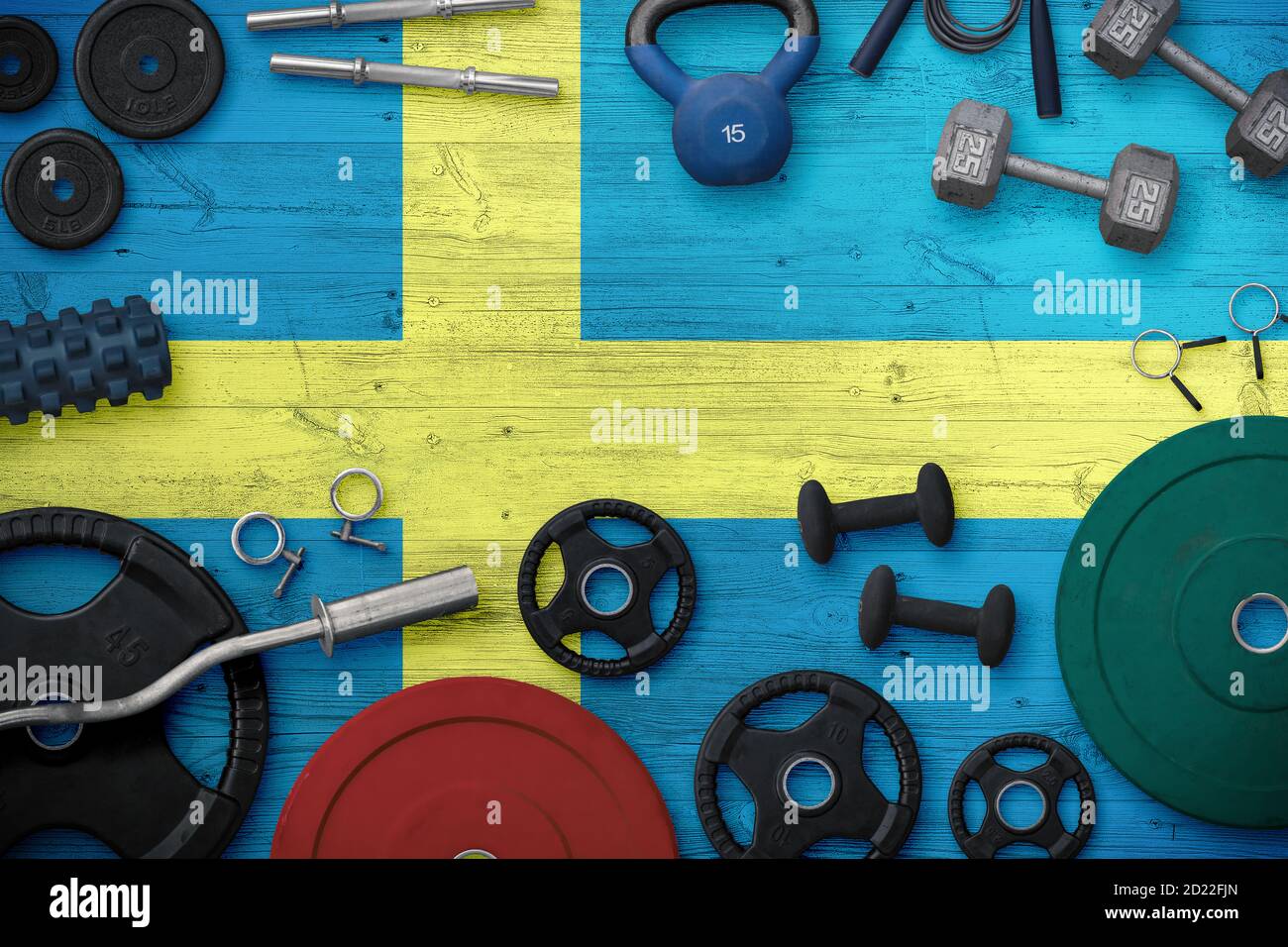 Sweden sports and fitness concept. Top view of heavy weight plates with ...