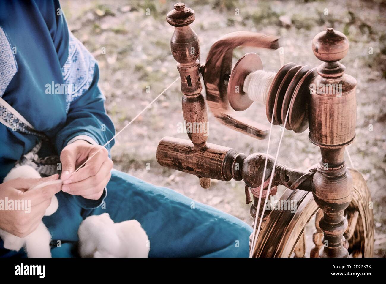 Vintage distaff creates threads from a spindle. Hand retro spinning ...