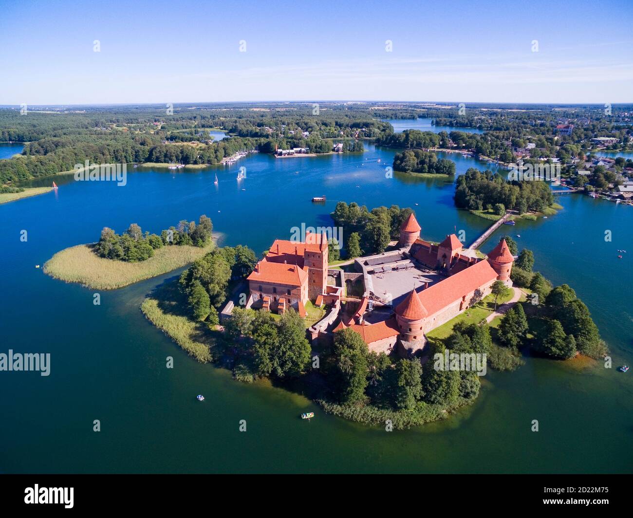 Aerial view of beautiful Gothic style red brick castle on an island on ...
