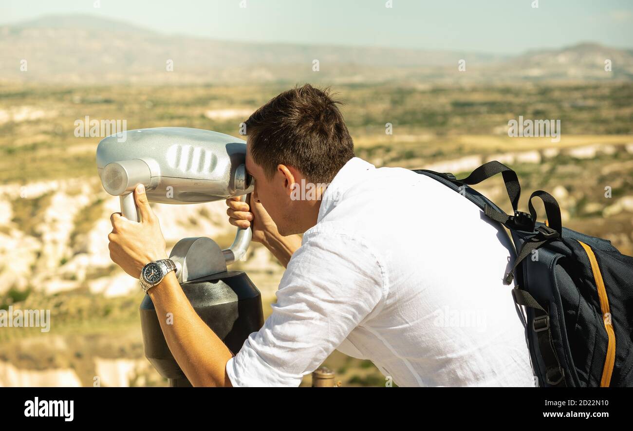 Man looking through horizontally outdoor viewer at lookout in Turkey ...
