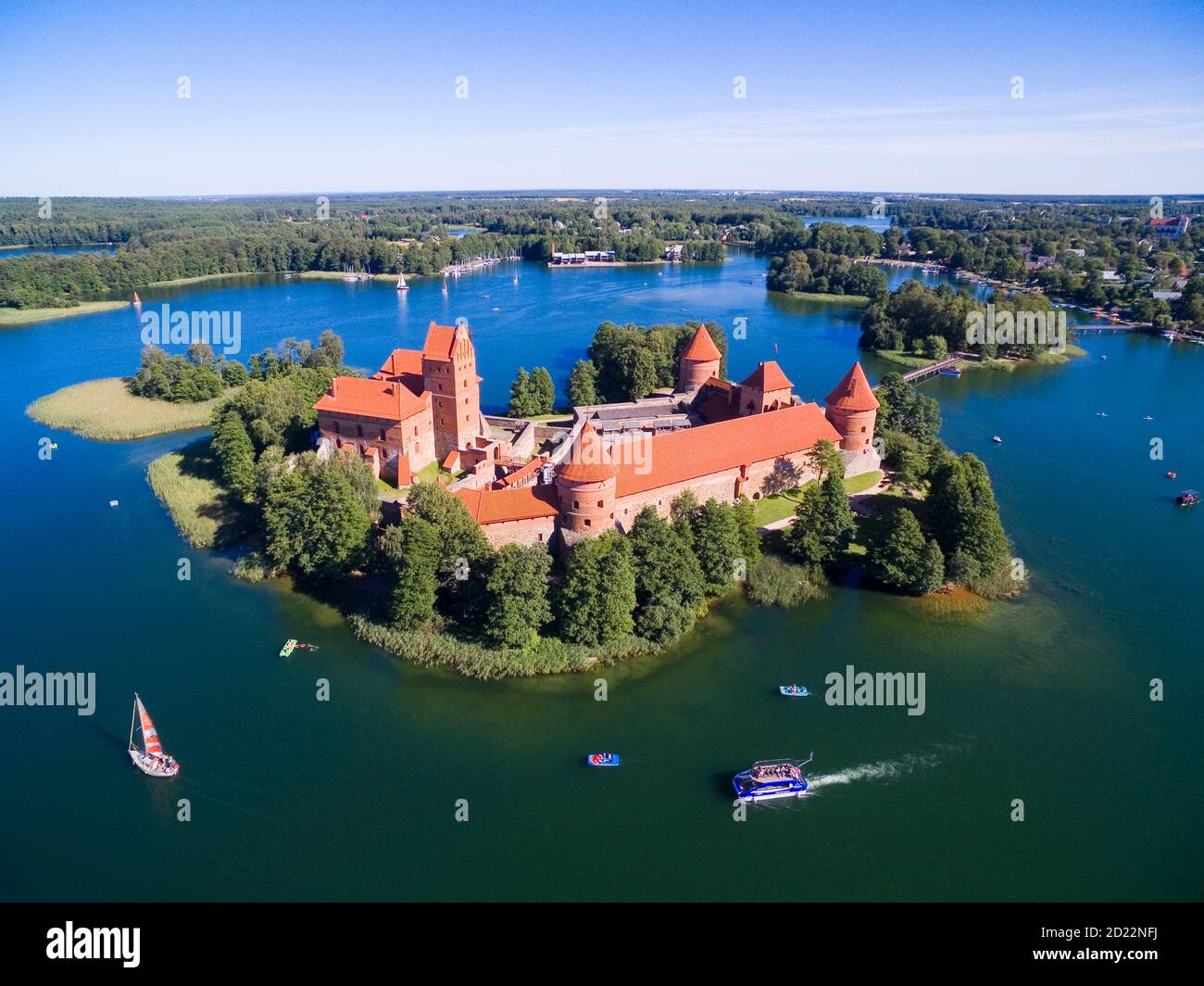 Aerial view of beautiful Gothic style red brick castle on an island on ...