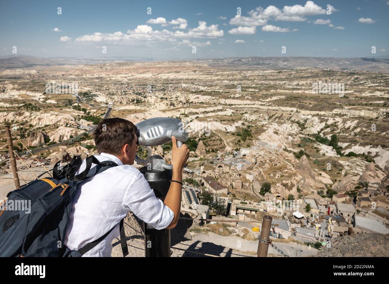 Man looking through horizontally outdoor viewer at lookout in Turkey ...