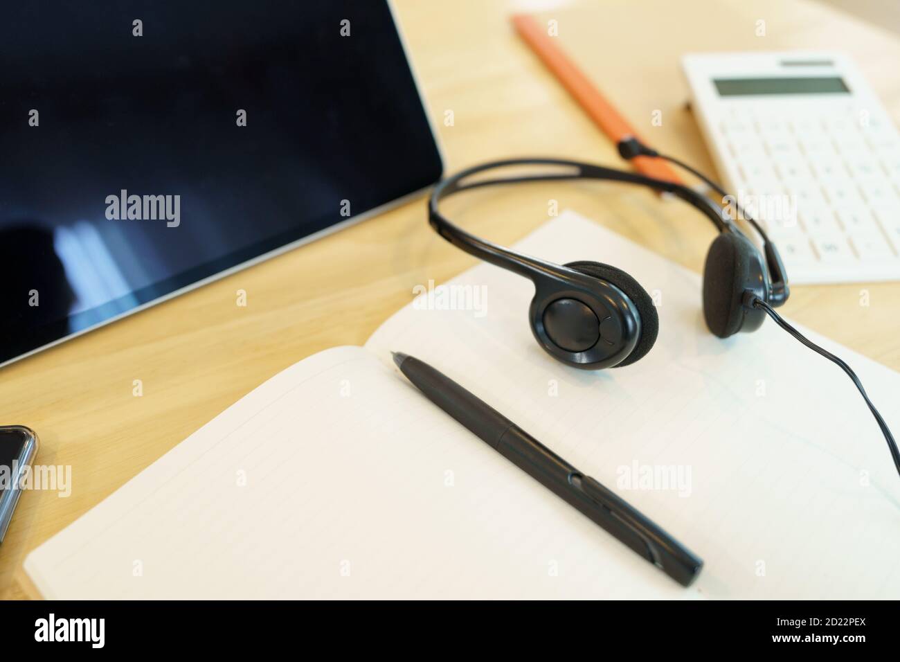 Headphones and school supplies Teleconference using lesson online ...
