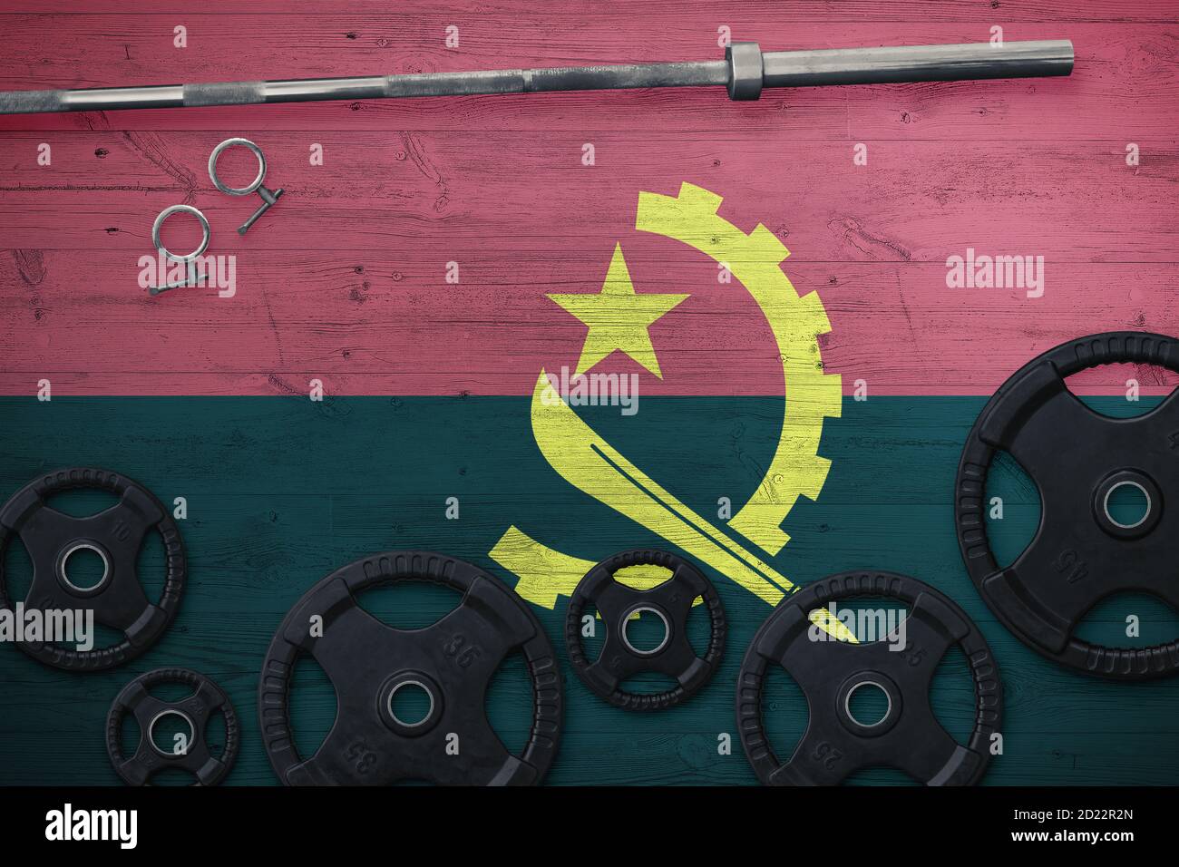 Angola gym concept. Top view of heavy weight plates with iron bar on ...