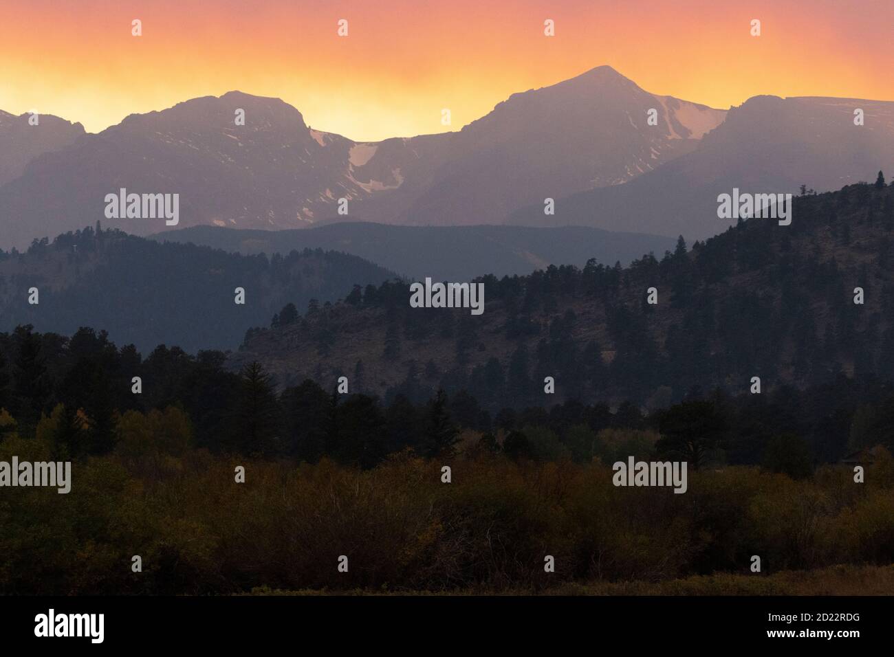 Sunset through the smoke of wildfire on Longs Peak Colorado and Moraine ...