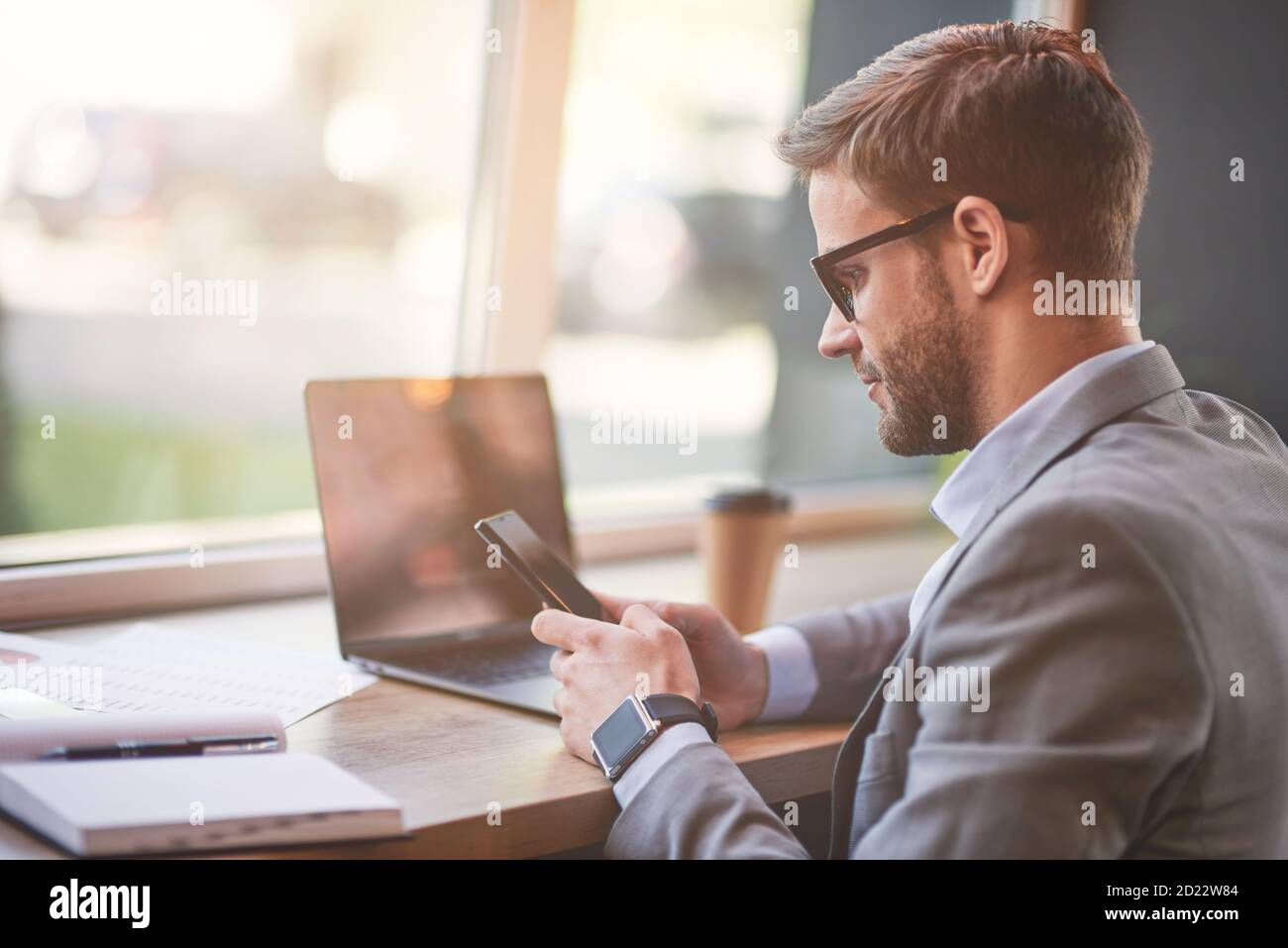 Working remotely with cell phone hi-res stock photography and images ...