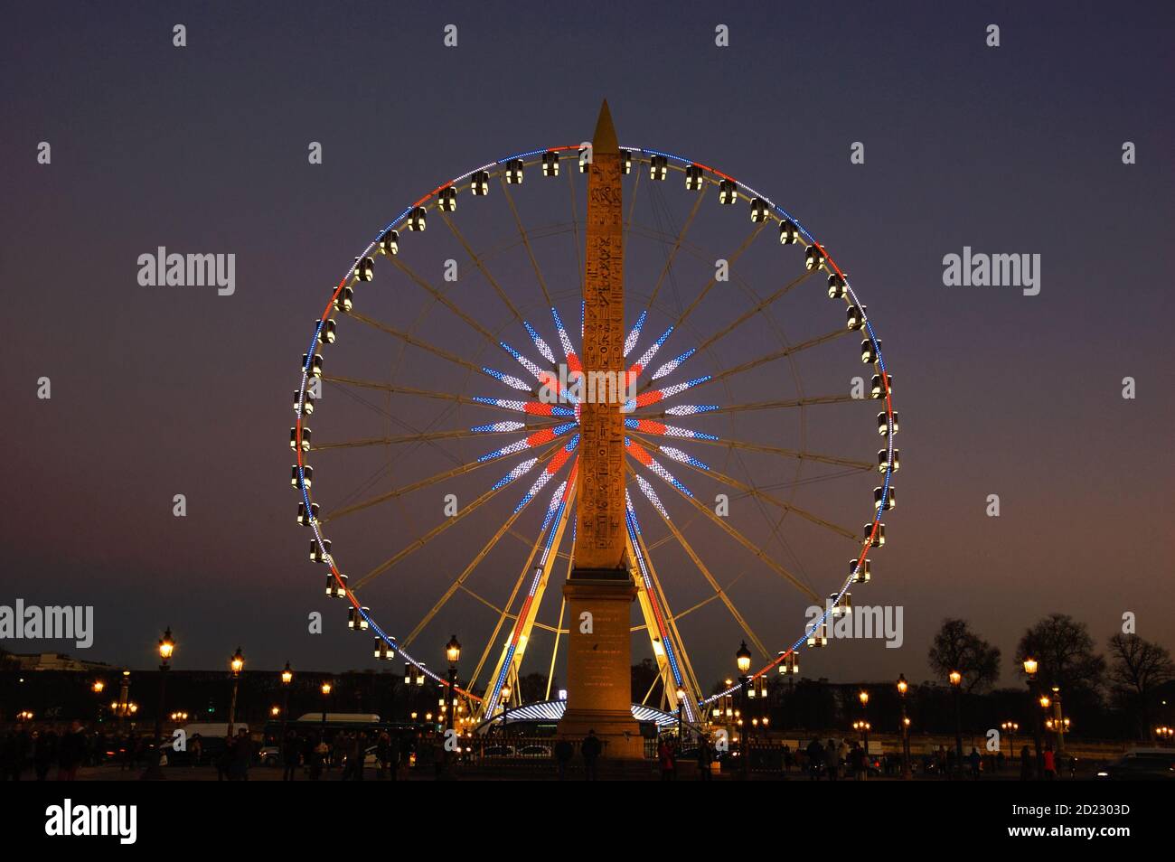 Place de la Concorde at night. Ferris wheel and Egyptian obelisk. Paris ...