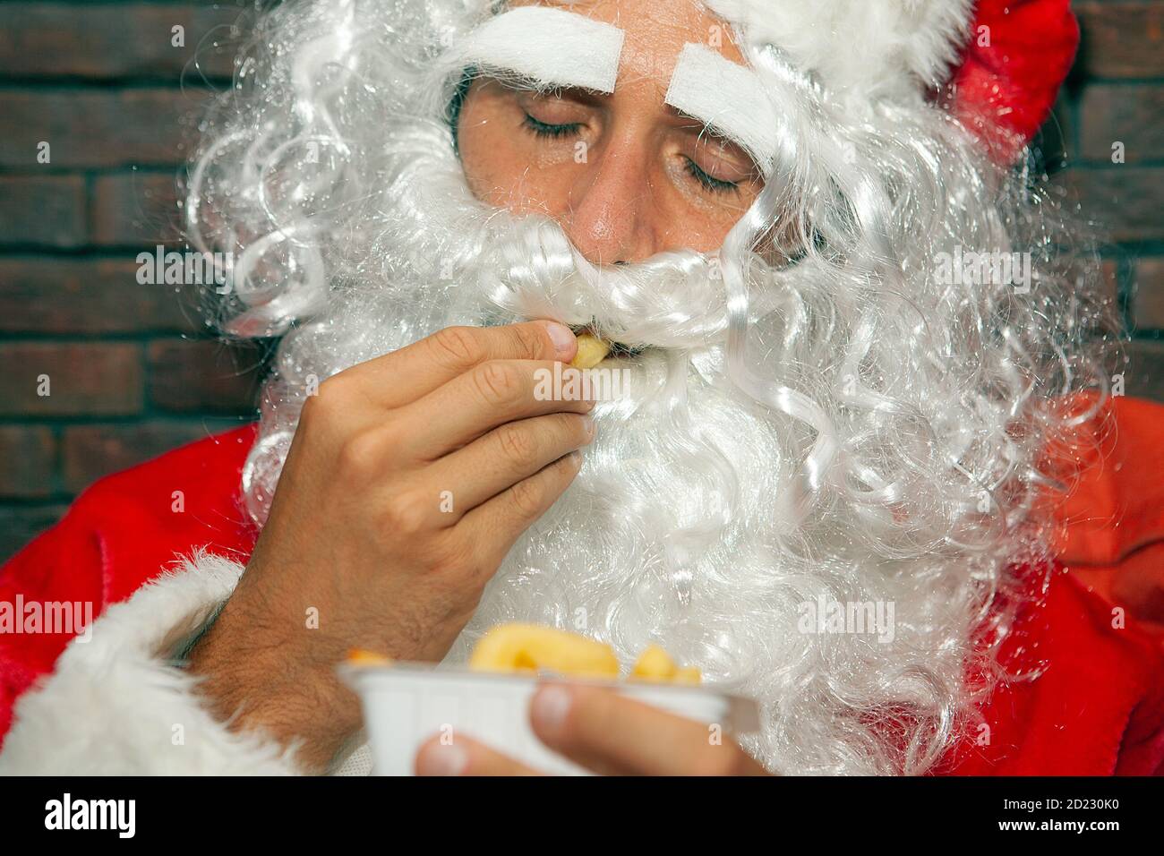 Fat santa claus eating hi-res stock photography and images - Alamy