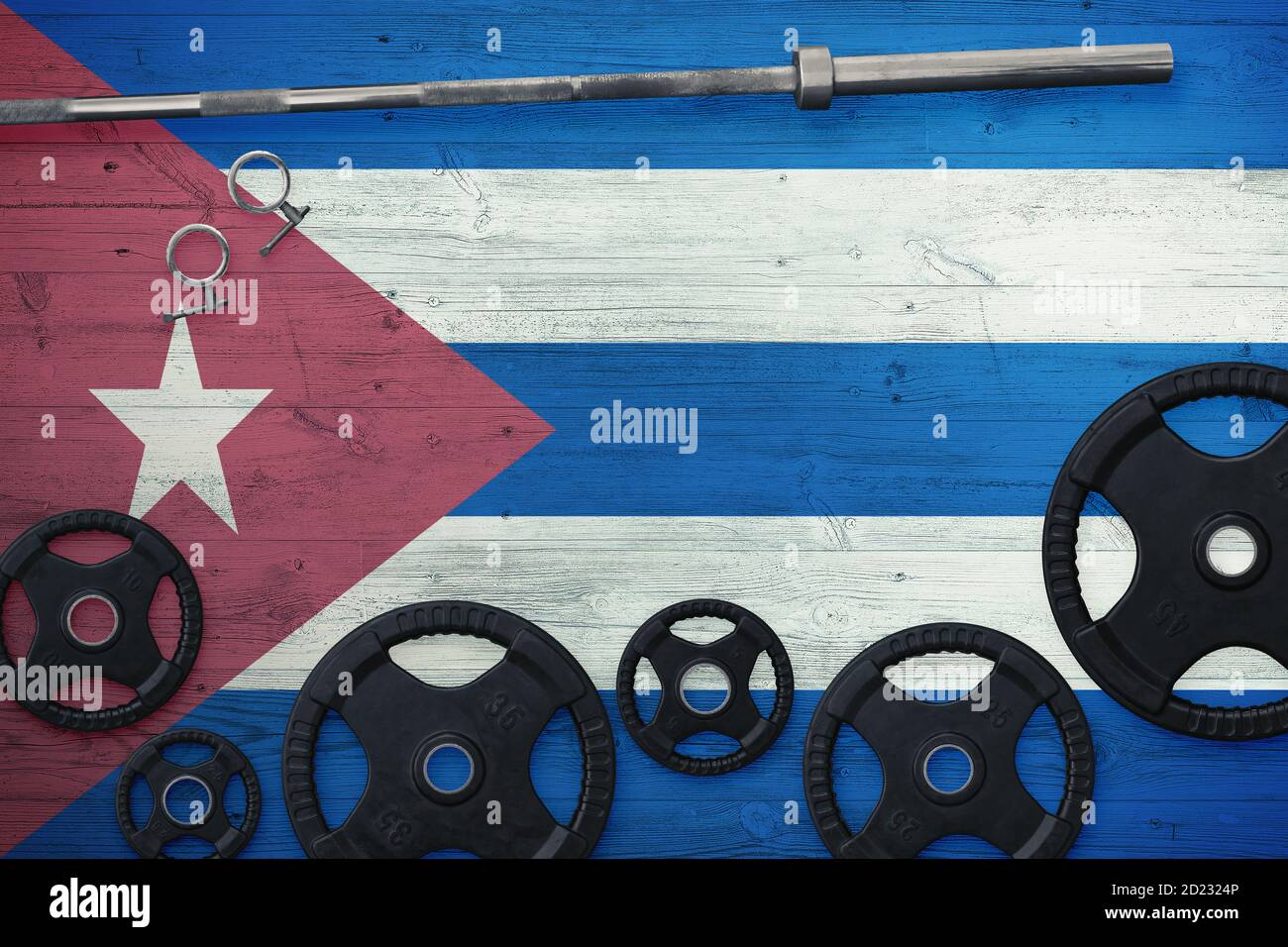 Cuba gym concept. Top view of heavy weight plates with iron bar on ...