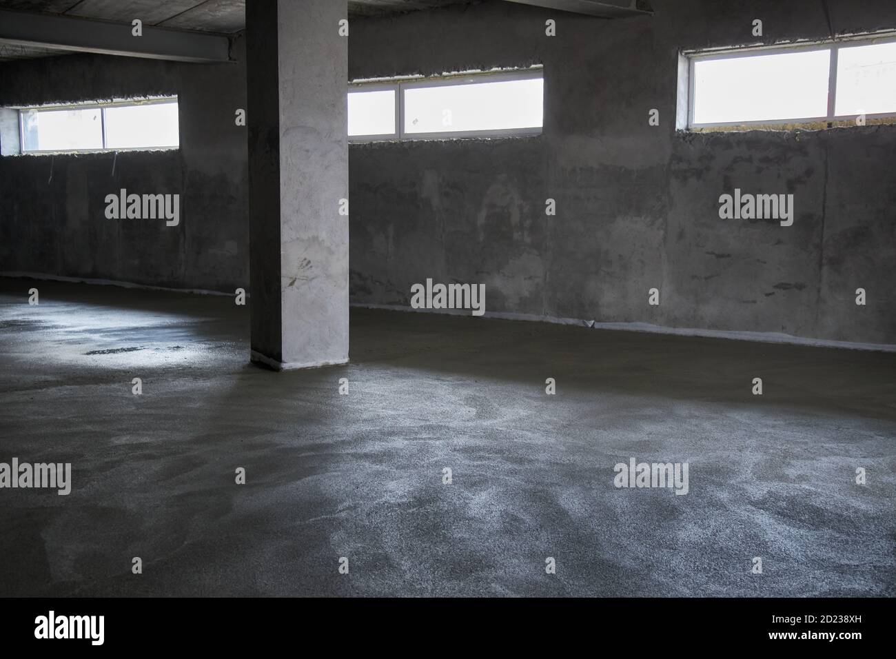 Filling the floor with concrete, screed and leveling the floor. Smooth ...