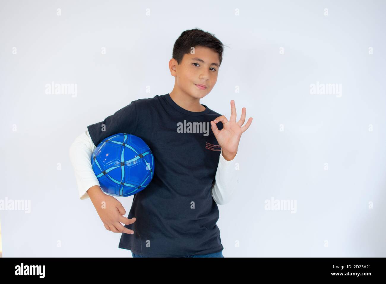 Happy schoolboy with backpack and soccer ball isolated on white ...