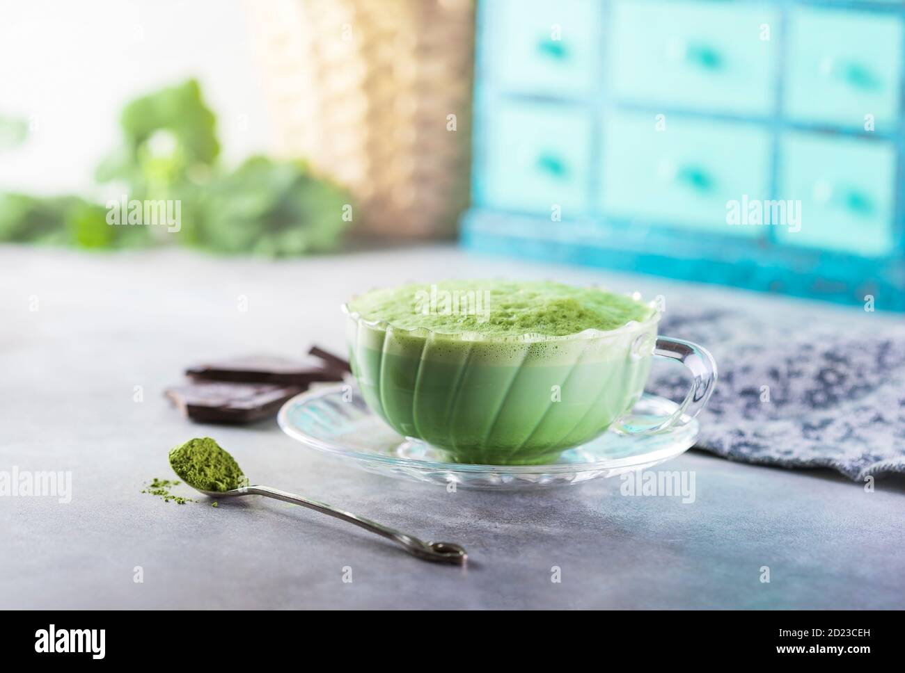 Hot Matcha green tea latte in a cup on a light background. Fashionable ...