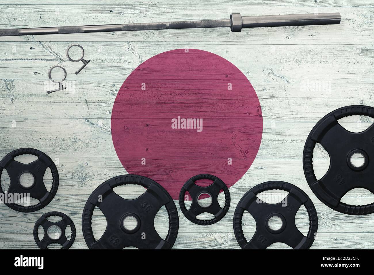 Japan gym concept. Top view of heavy weight plates with iron bar on ...