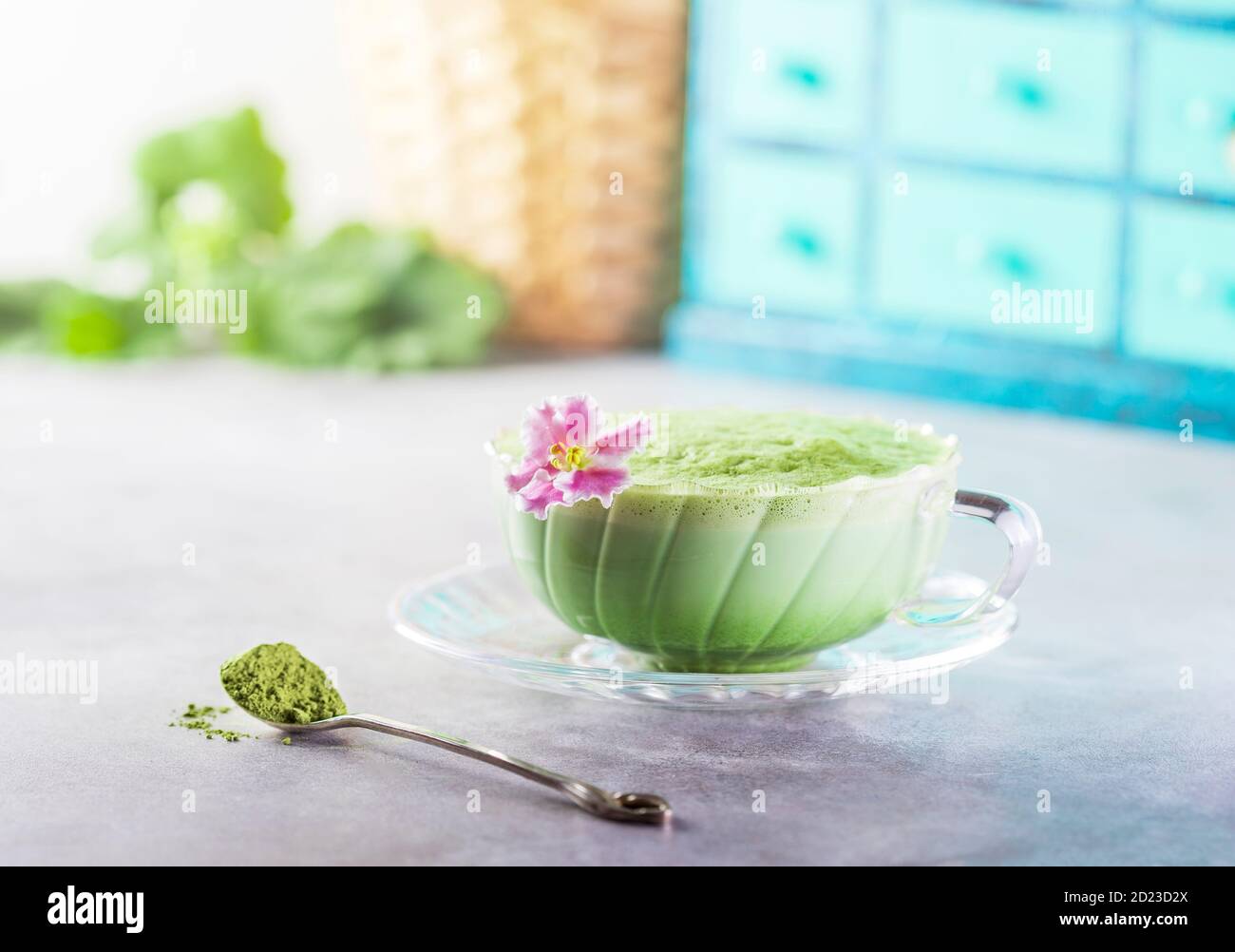 Hot Matcha green tea latte in a cup on a light background. Fashionable ...