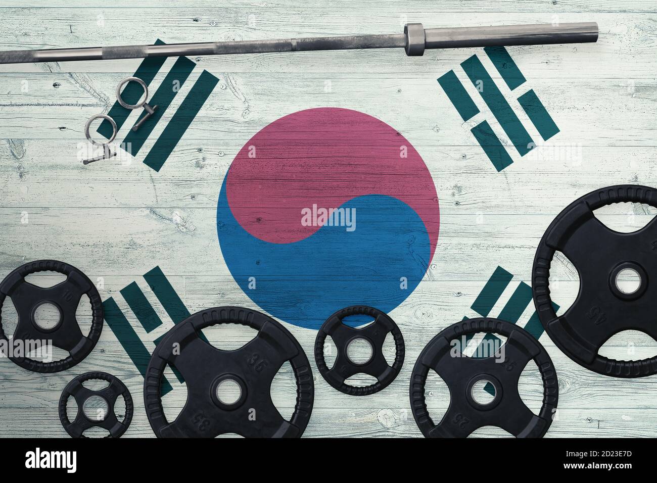 South Korea gym concept. Top view of heavy weight plates with iron bar ...