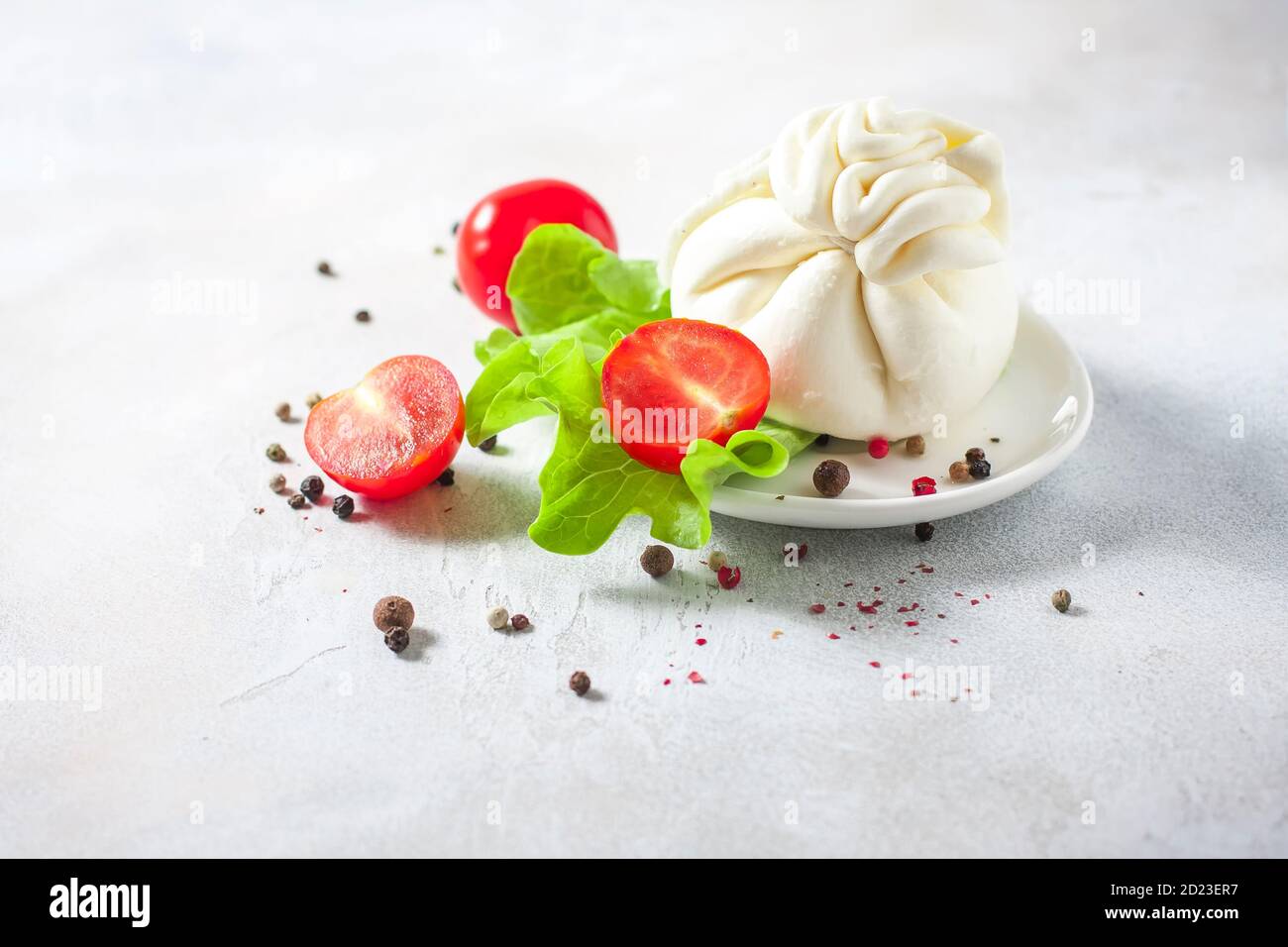 Italian Cream Burrata Cheese on light background Stock Photo - Alamy