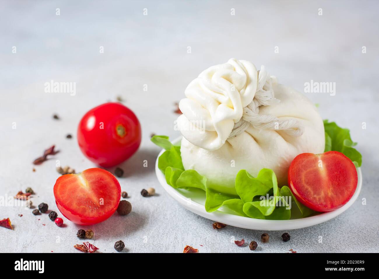 Italian Cream Burrata Cheese on light background Stock Photo - Alamy