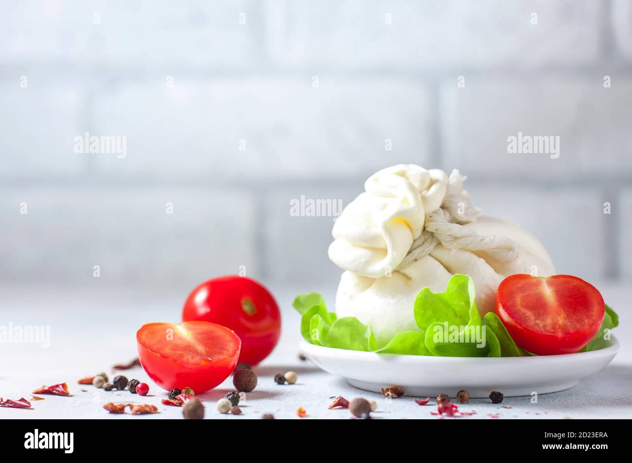 Italian Cream Burrata Cheese on light background Stock Photo - Alamy