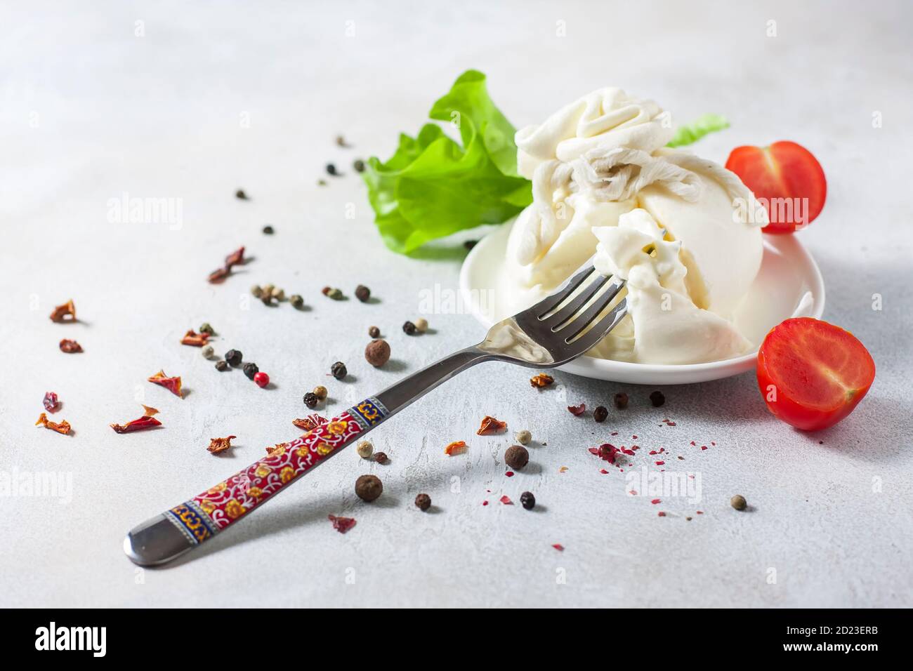 Italian Cream Burrata Cheese on light background Stock Photo - Alamy