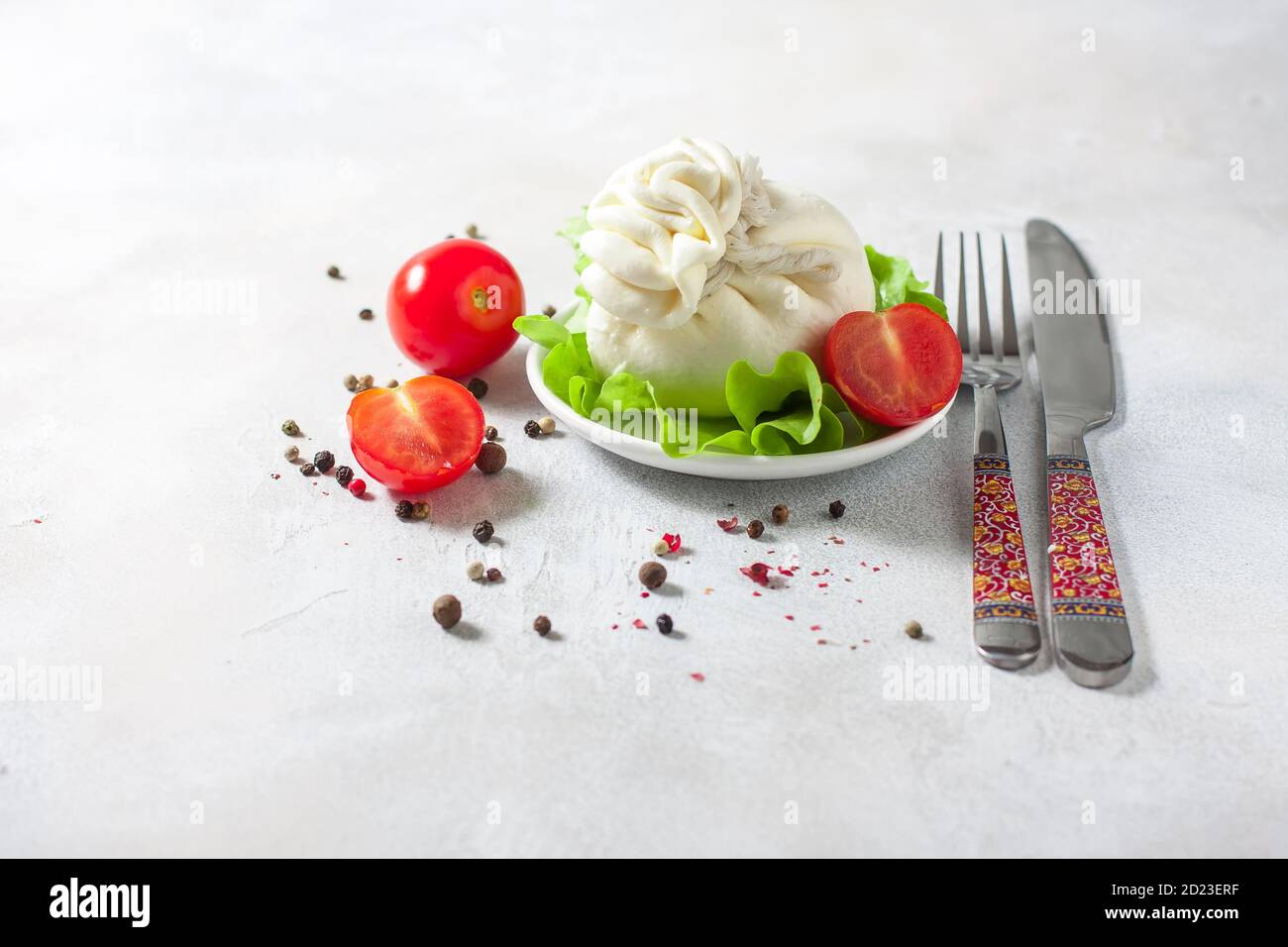 Italian Cream Burrata Cheese on light background Stock Photo - Alamy