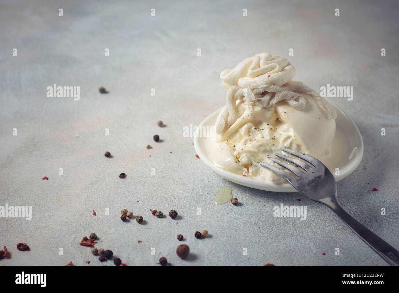 Italian Cream Burrata Cheese on light background Stock Photo - Alamy