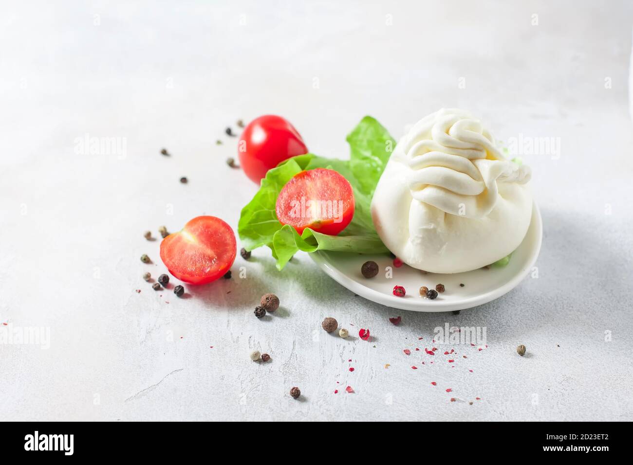 Italian Cream Burrata Cheese on light background Stock Photo - Alamy