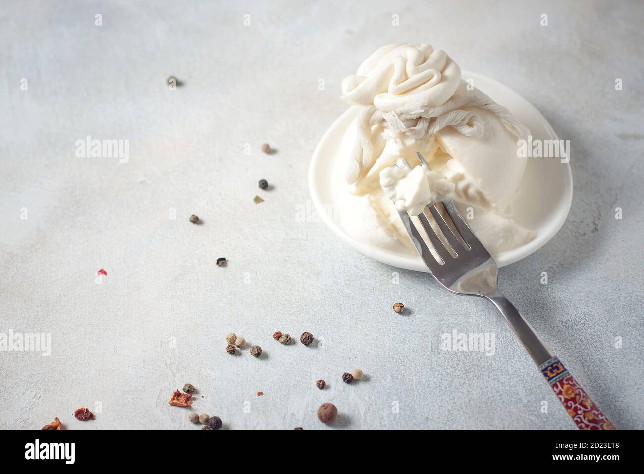 Italian Cream Burrata Cheese on light background Stock Photo - Alamy