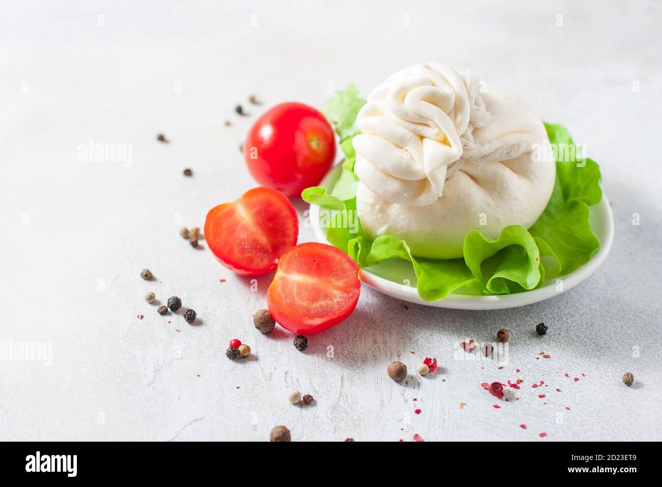 Italian Cream Burrata Cheese on light background Stock Photo - Alamy