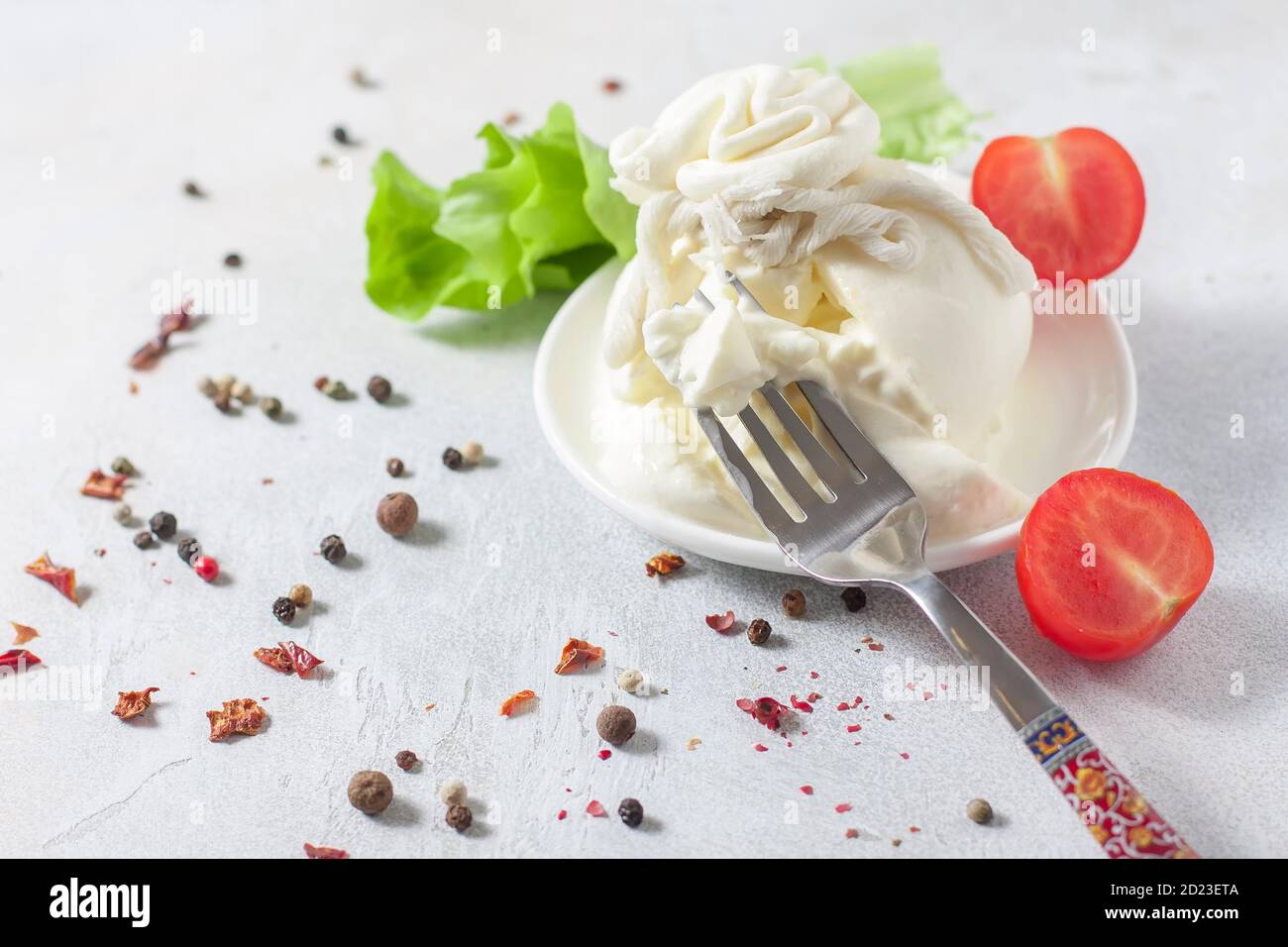 Italian Cream Burrata Cheese on light background Stock Photo - Alamy