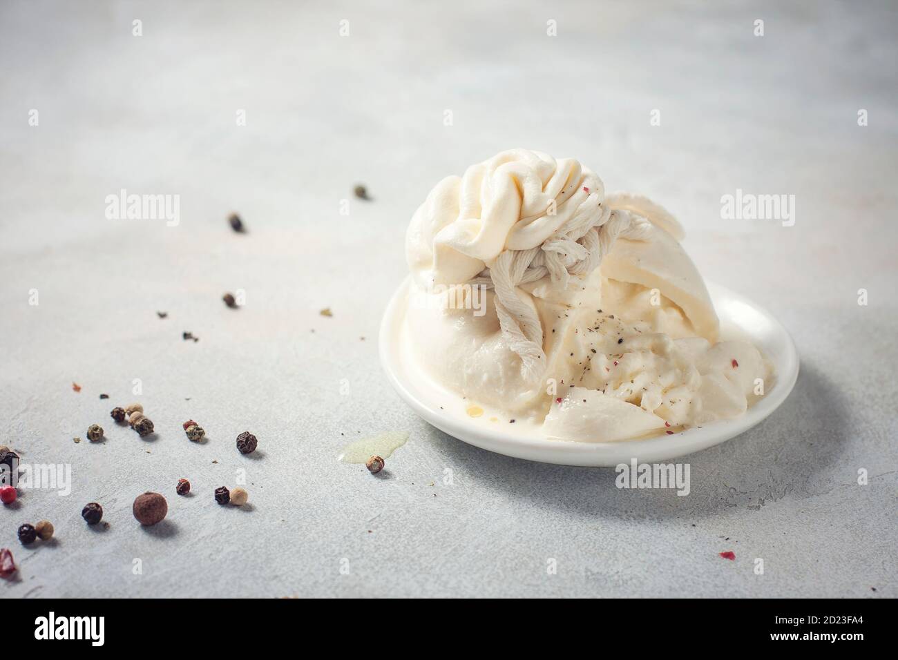 Italian Cream Burrata Cheese on light background Stock Photo - Alamy