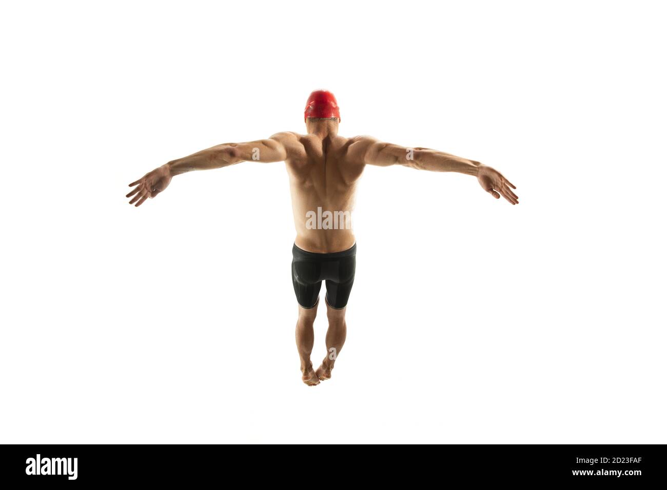 Dynamic. Caucasian professional sportsman, swimmer training isolated on ...