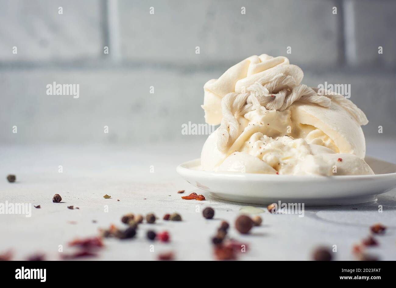 Italian Cream Burrata Cheese on light background Stock Photo - Alamy