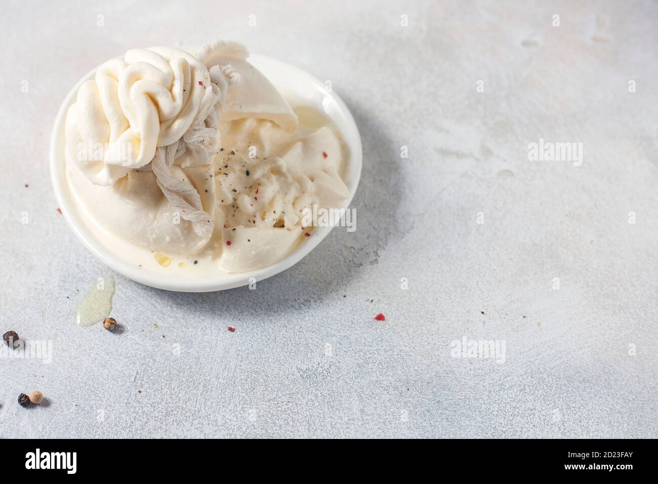 Italian Cream Burrata Cheese on light background Stock Photo - Alamy