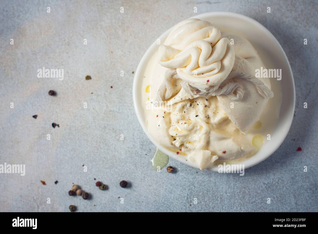 Italian Cream Burrata Cheese on light background Stock Photo - Alamy