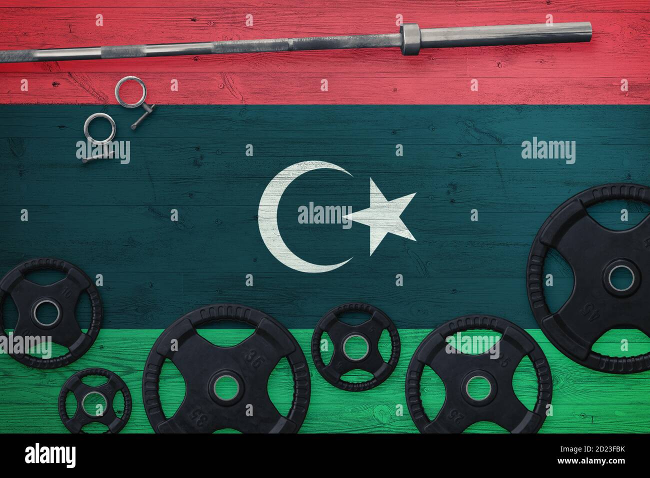 Libya gym concept. Top view of heavy weight plates with iron bar on ...