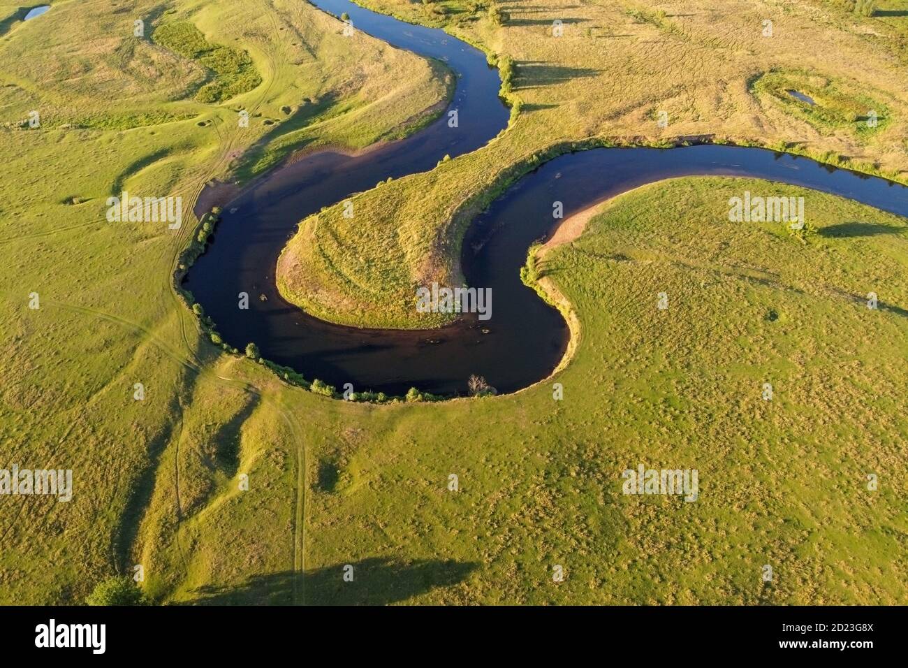 Winding river, aerial view. Summer landscape, top view. A green valley ...
