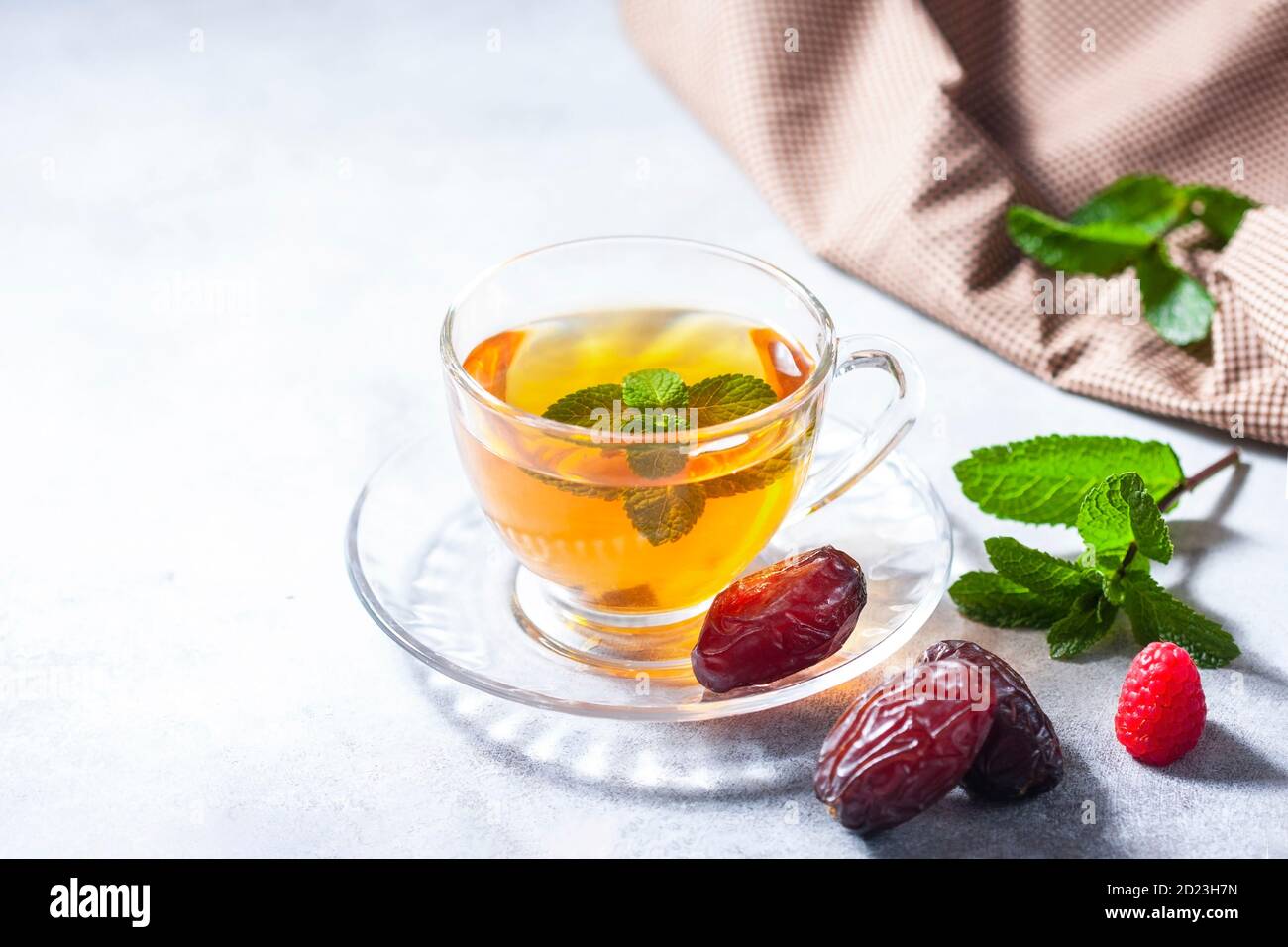 Mint tea with dates. Arabic style Stock Photo - Alamy