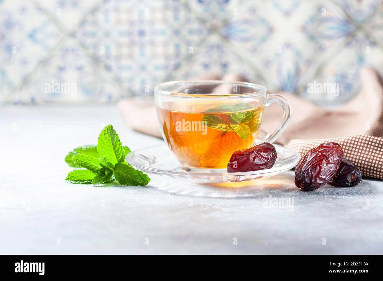 Mint tea with dates. Arabic style Stock Photo - Alamy