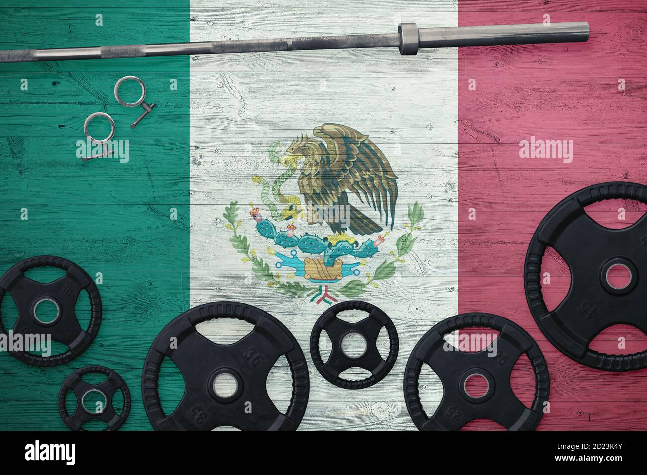 Mexico gym concept. Top view of heavy weight plates with iron bar on ...