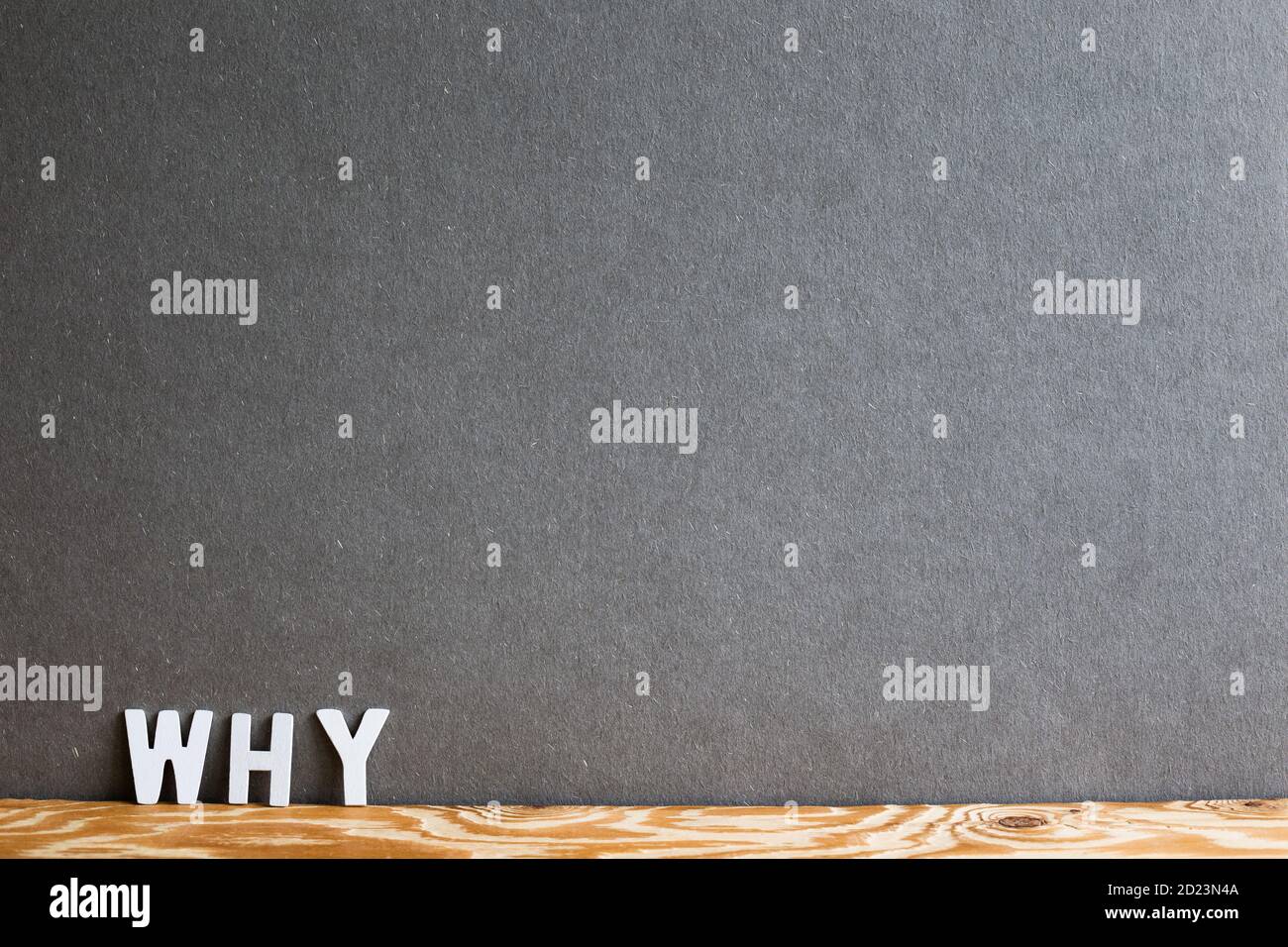 Why question word on wooden table with gray background. Thinking ...