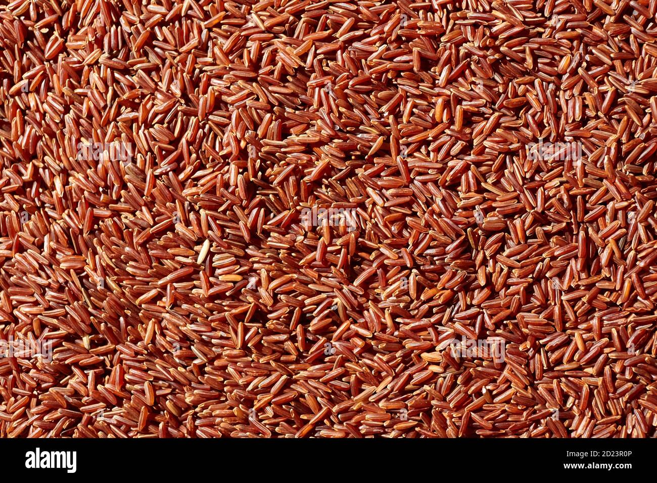Red rice texture background. Uncooked dry grains Stock Photo - Alamy
