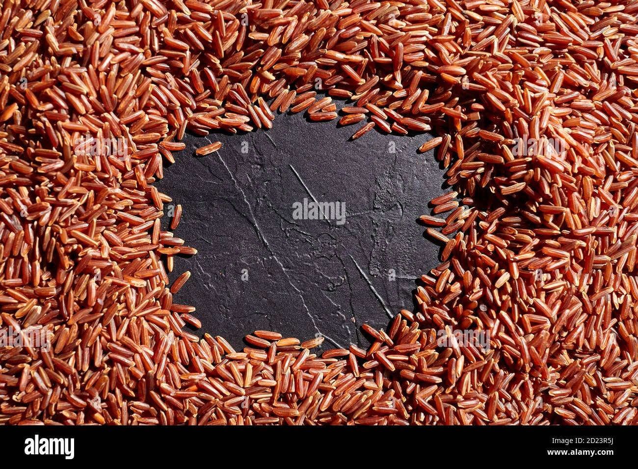 Frame of red brown rice grains, food background, cereal seeds, border ...