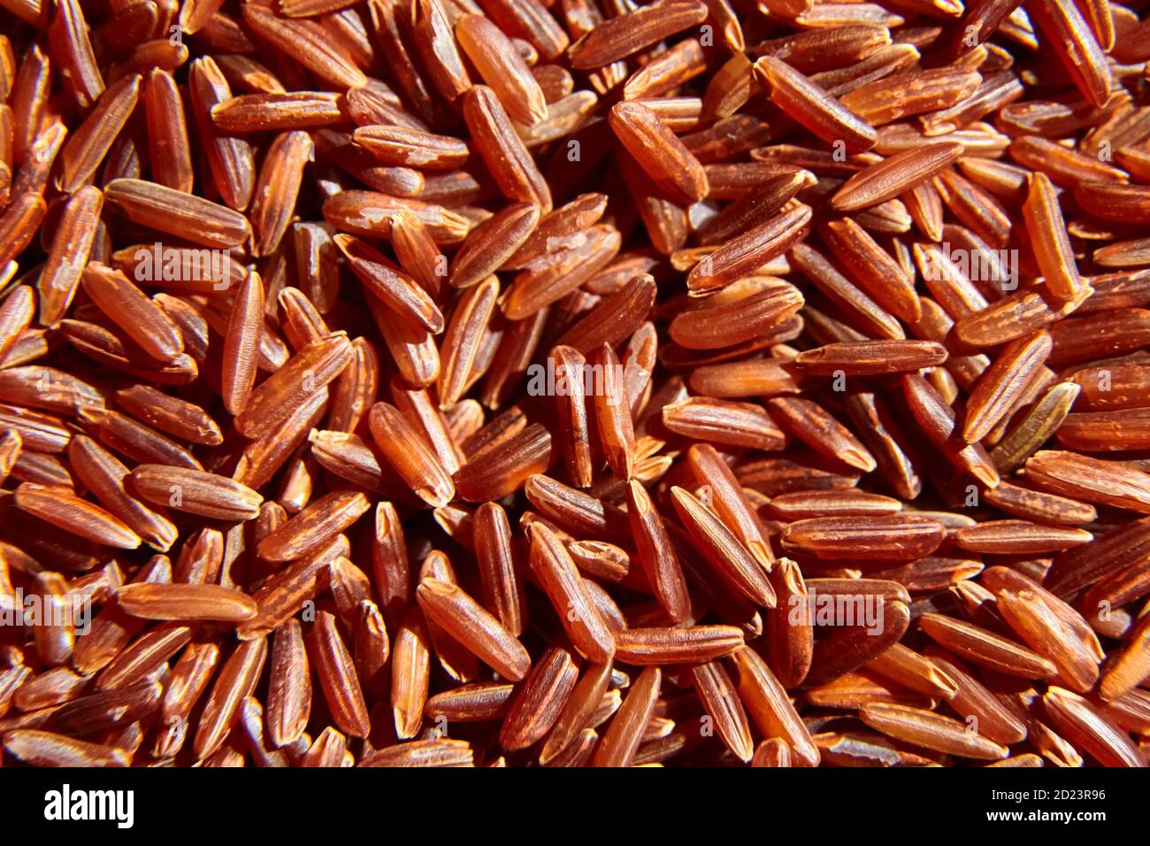 Red rice texture background. Uncooked dry grains, macro Stock Photo - Alamy