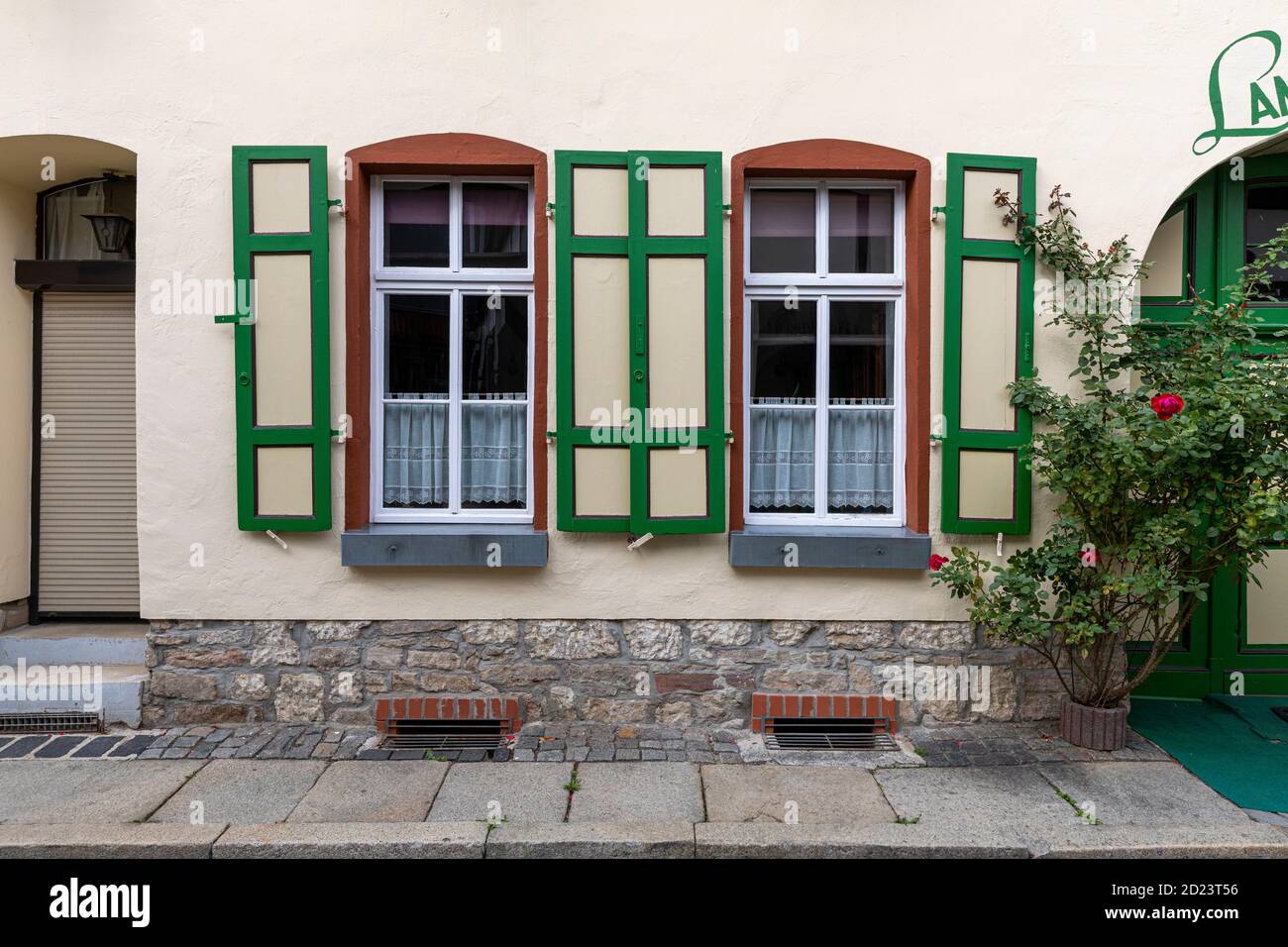 Historical building facade with shutters protecting windows Stock Photo ...