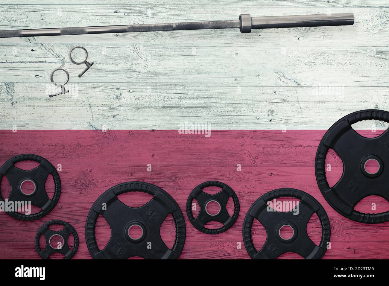 Poland gym concept. Top view of heavy weight plates with iron bar on ...