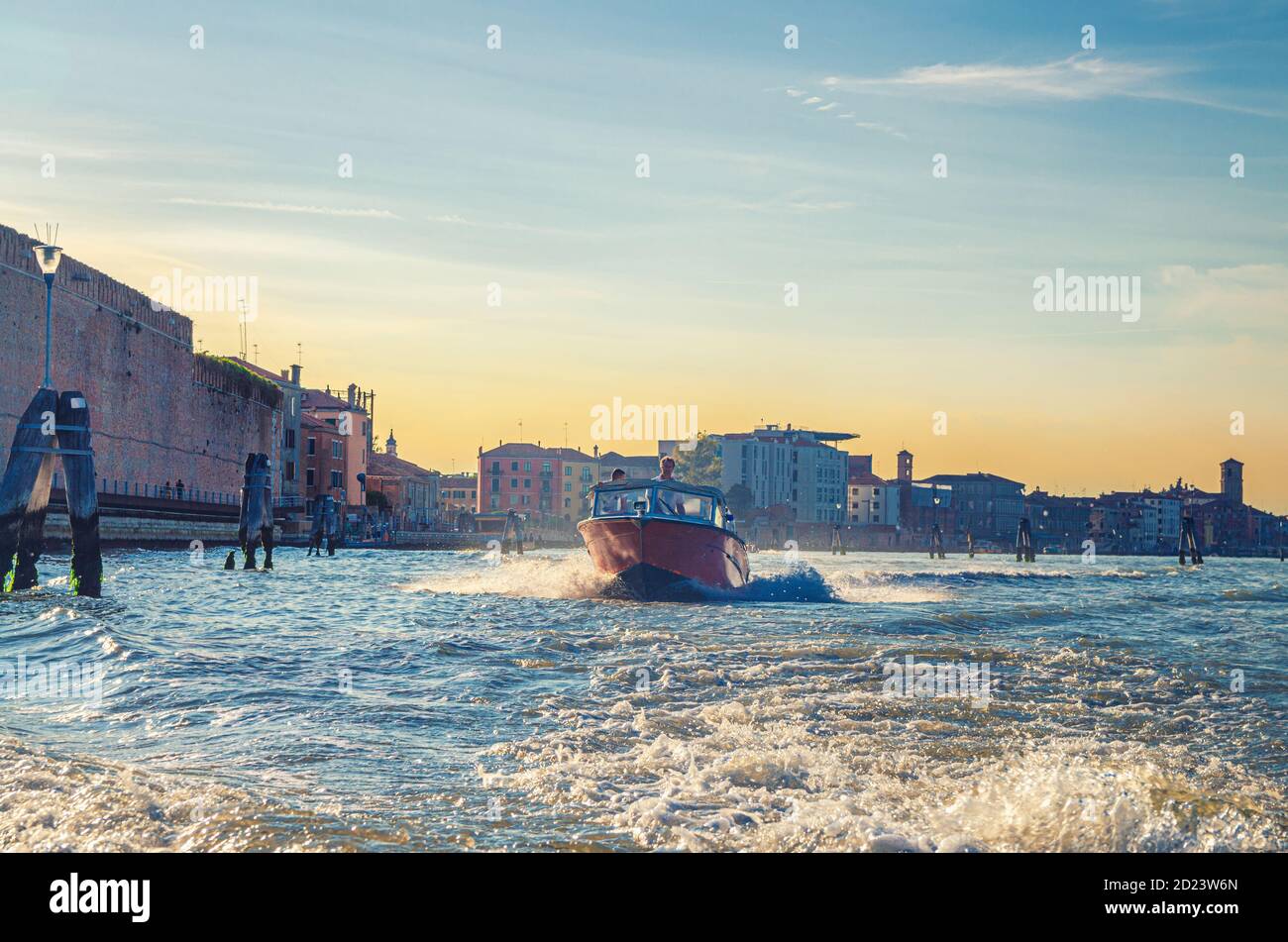Venice, Italy, September 14, 2019: Yachtman driving yacht boat racing ...