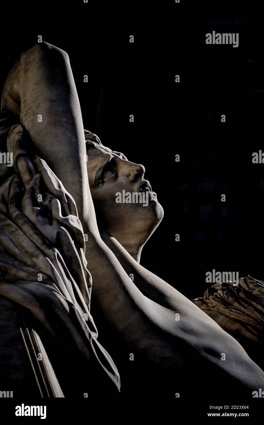 Trojan warrior weeps as he lies dying. Marble tear runs from right eye ...